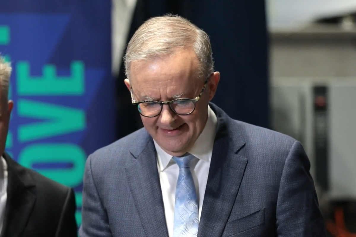 Labor team caught passing notes to Albanese mid-press conference